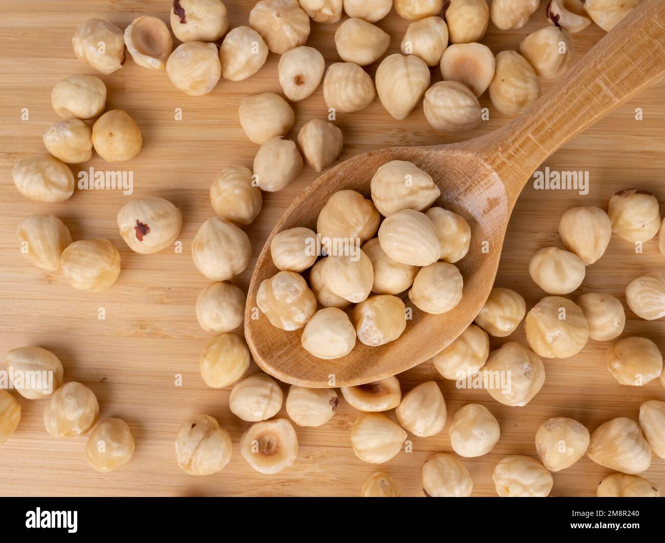 Top View Unshelled Hazelnuts in a Spoon on Wooden Floor. Copy Space ...