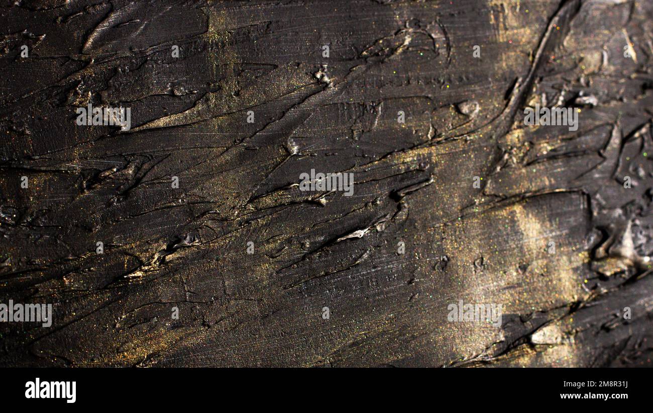 Microtexture black relief strokes with golden plating Stock Photo - Alamy
