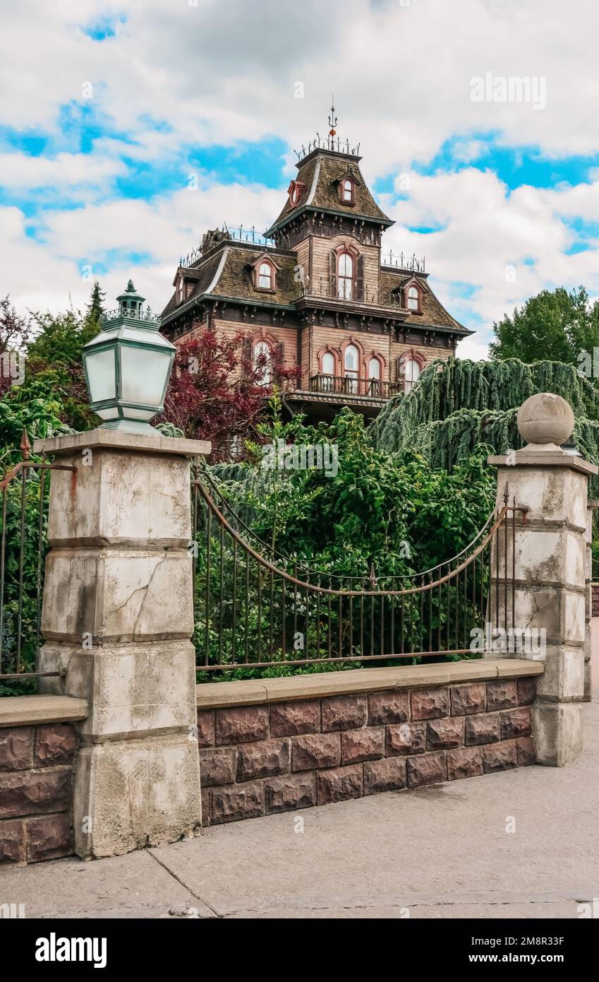 A vertical shot of the Haunted Mansion designed in old-style Disneyland ...
