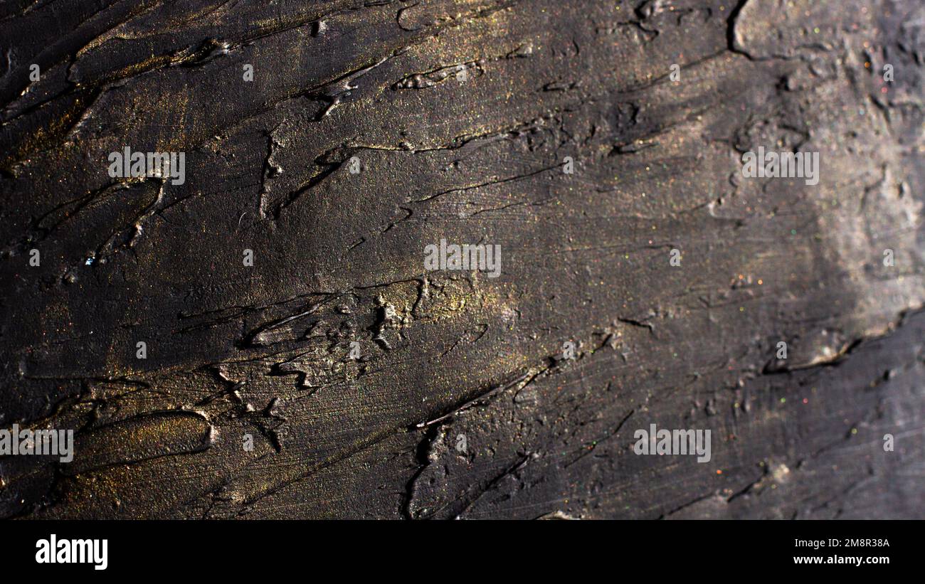 Microtexture dark rough sections with shiny gold Stock Photo - Alamy