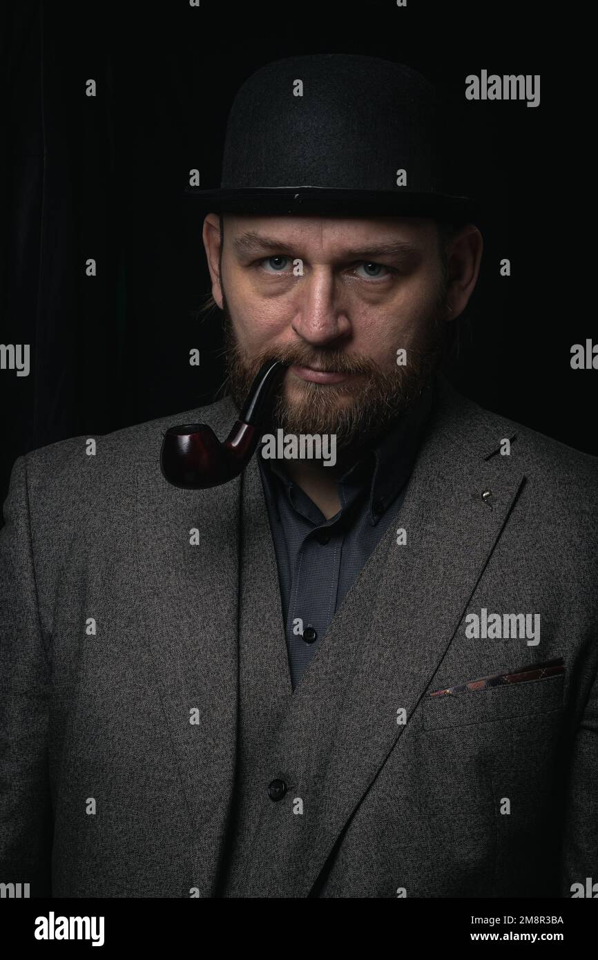 stylish man in retro outfit suit hat smoking wooden pipe sherlock ...
