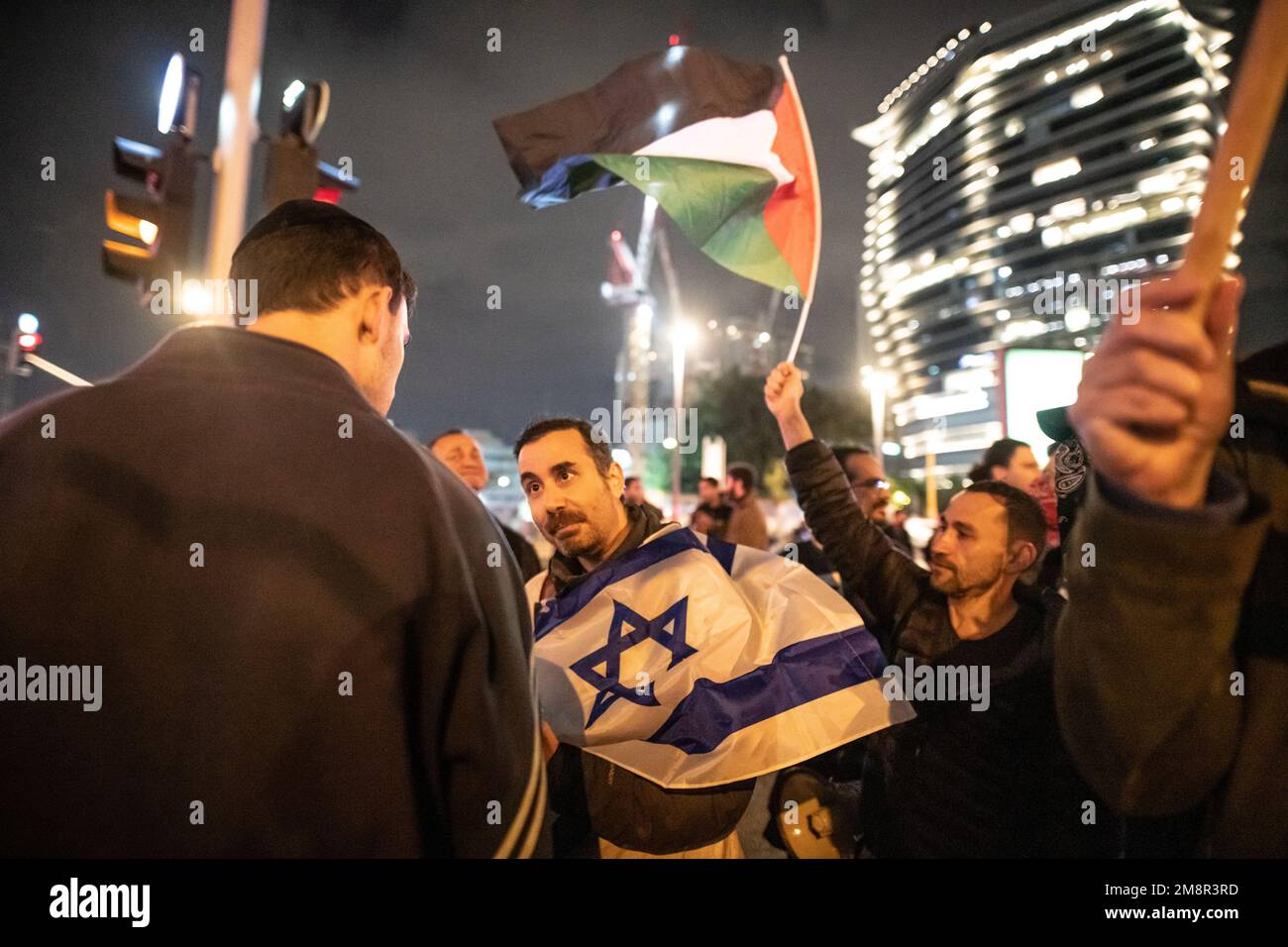 Israel. 14th Jan, 2023. Israeli peace activists carrying Palestine and ...