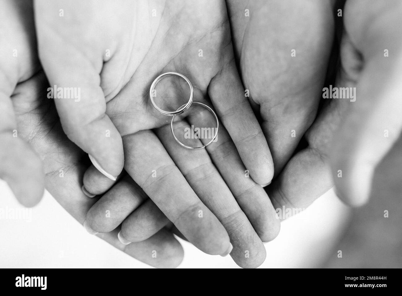 Husband and wife hands rings Black and White Stock Photos & Images - Alamy