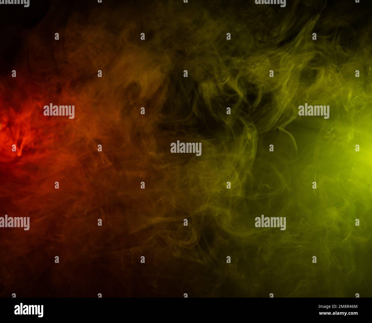 Red yellow green smoke on a black background Stock Photo - Alamy