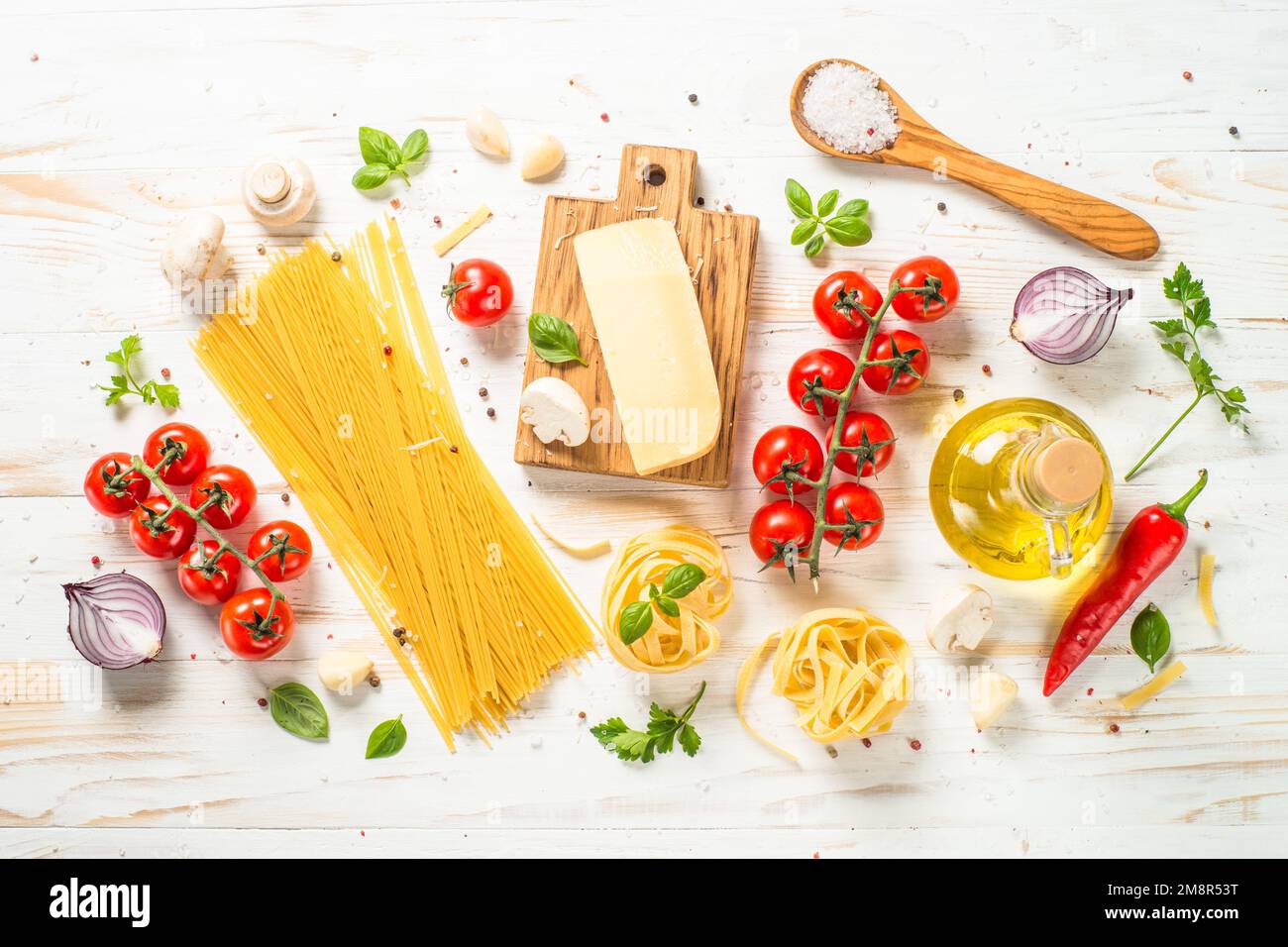 Italian food background on white kitchen table. Ingredients for cooking ...