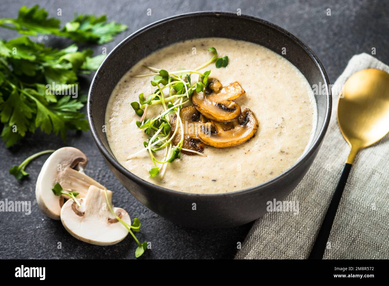 Mushroom Soup on dark stone table. Healthy vegan dish. Autumn soup ...