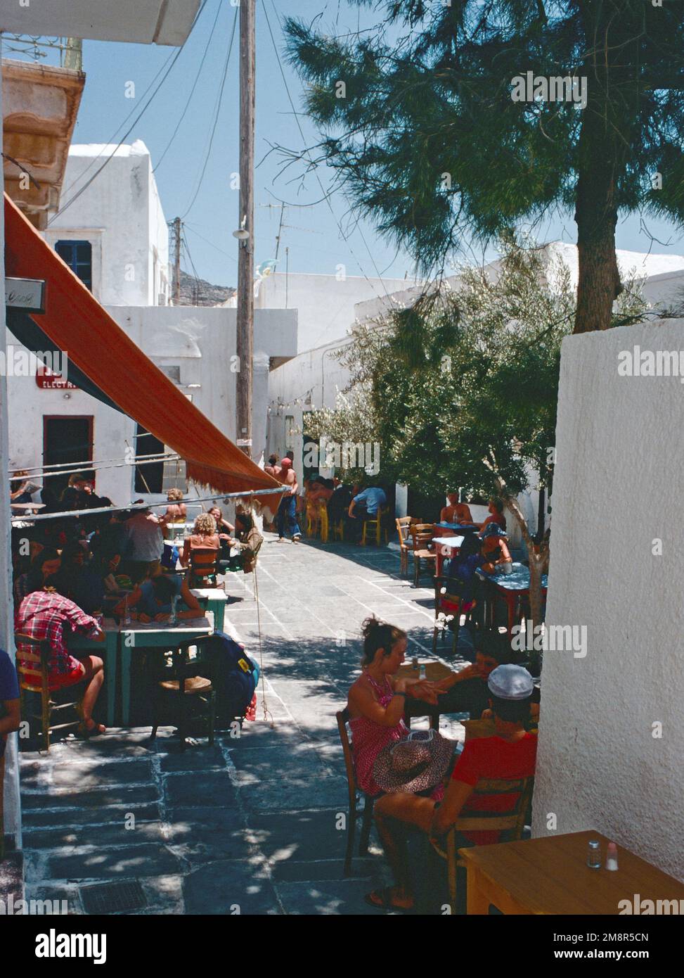 Scanned archival image of a cafe square at Ios in the Cyclades, Greece ...