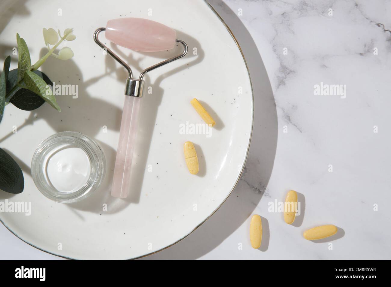 Different types of beauty products, face roller, collagen, vitamins ...