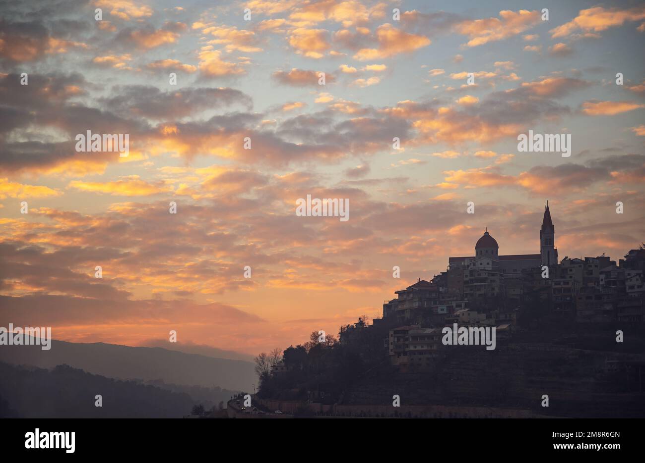 Mountainous Church over Sunset Sky Background Stock Photo - Alamy
