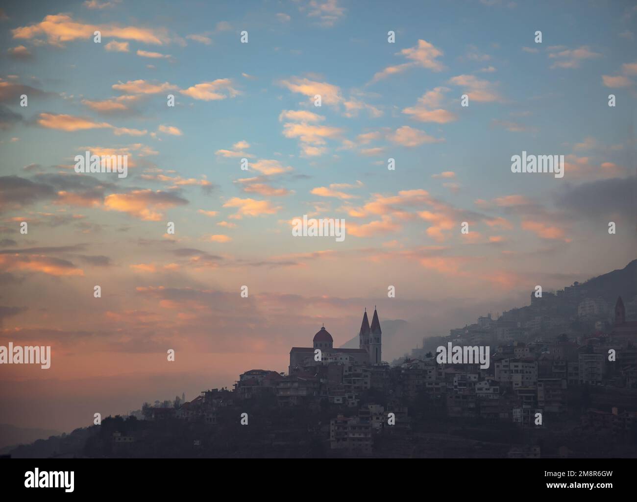 Mountainous Church over Sunset Sky Background Stock Photo - Alamy