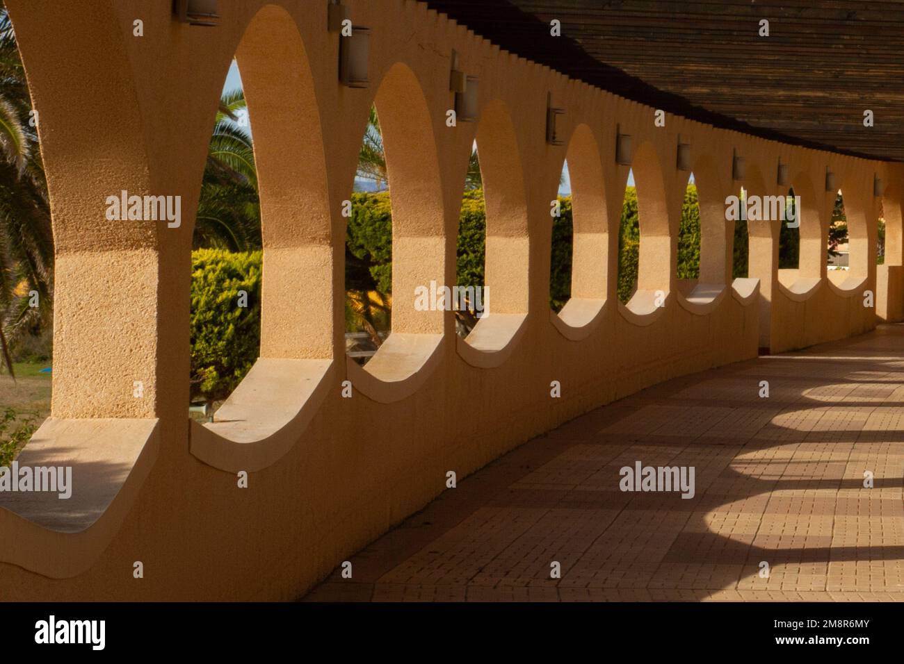 semicircular arch with round windows overlooking the sea Stock Photo ...