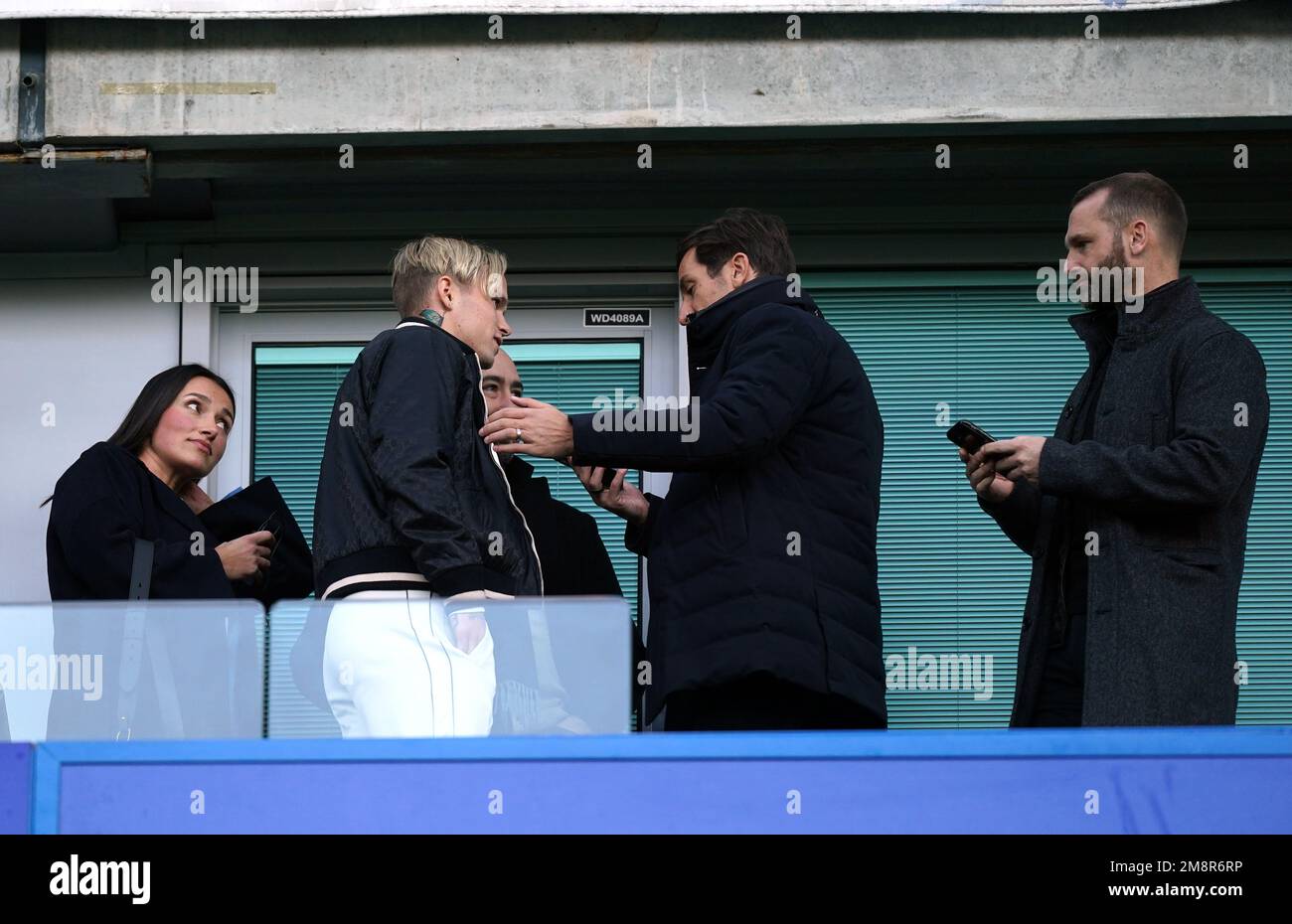 Chelsea new signing Mykhailo Mudryk (second left) in the stands ahead ...