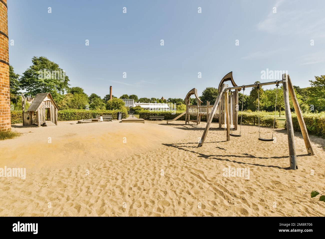 an empty playground with swings and slides in the middle part of the ...
