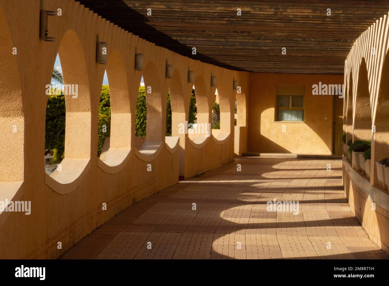 semicircular arch with round windows overlooking the sea Stock Photo ...
