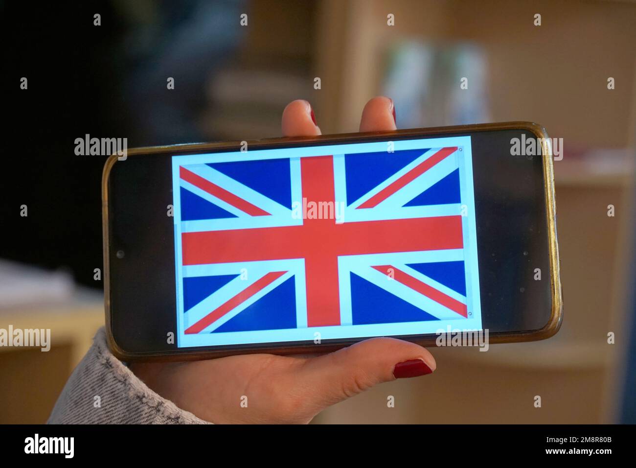 hand showing ,holding smartphone with UK flag on the dirty screen Stock ...