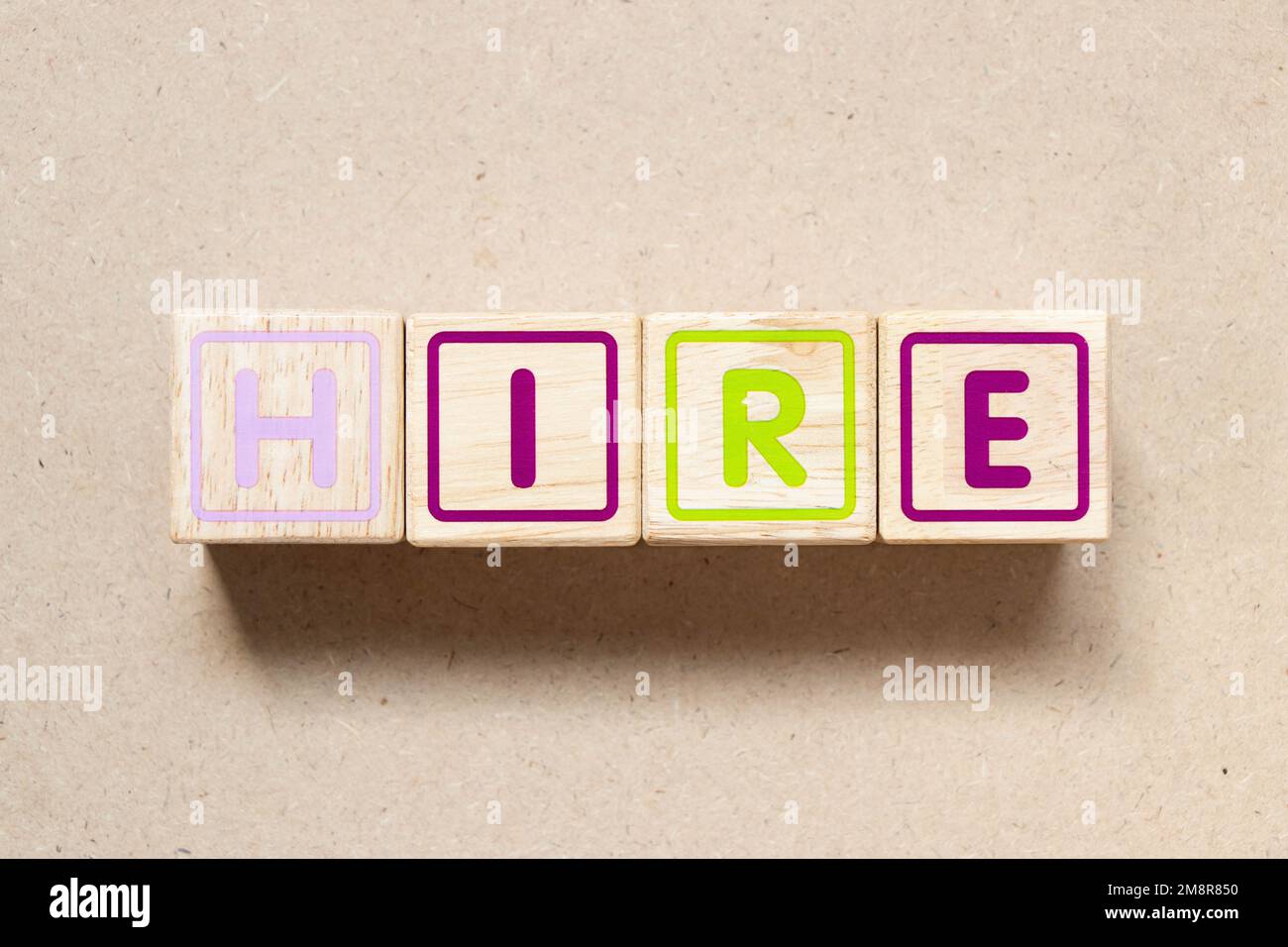 Color letter block in word hire on wood background Stock Photo - Alamy