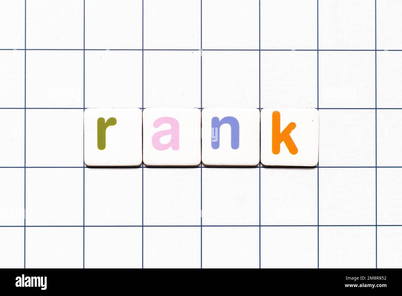 Colorful tile letter in word rank on white grid background Stock Photo ...