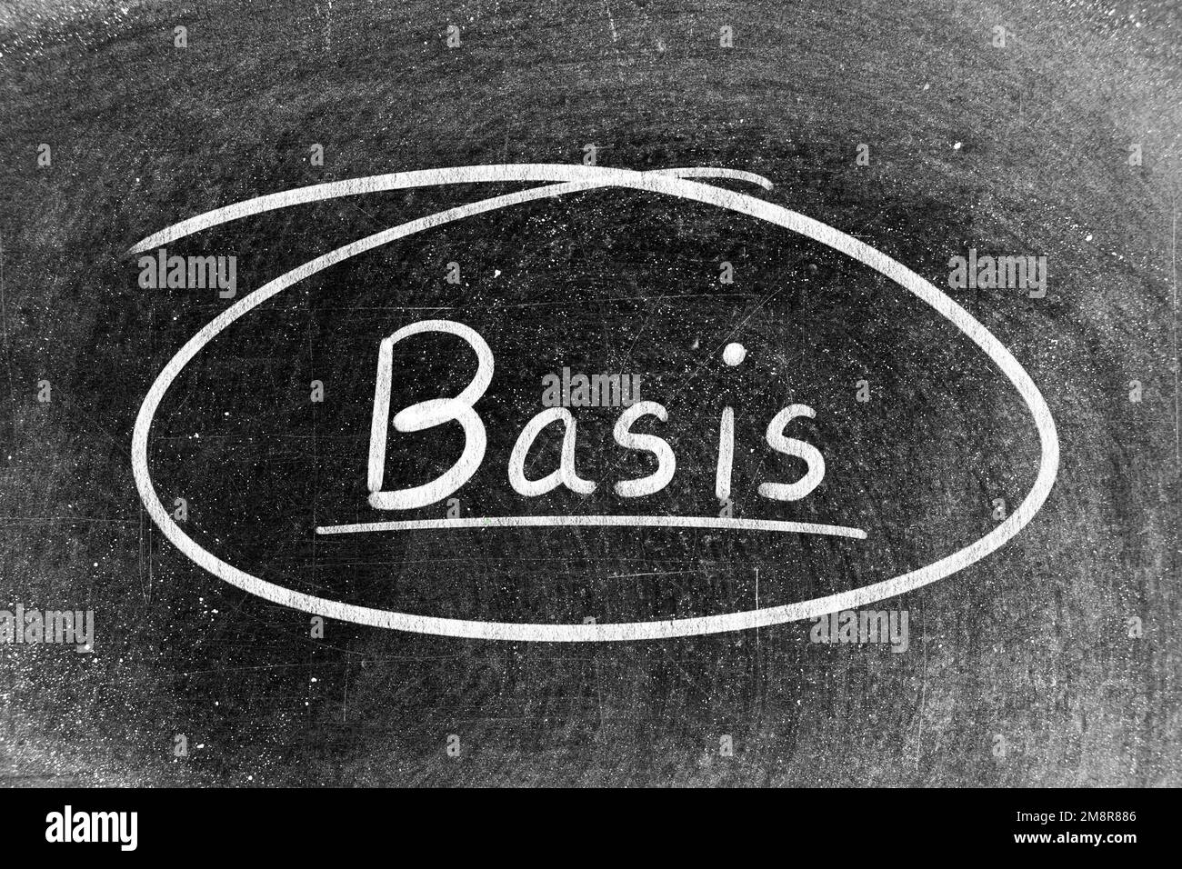 White chalk hand writing in word basis and circle shape on blackboard ...