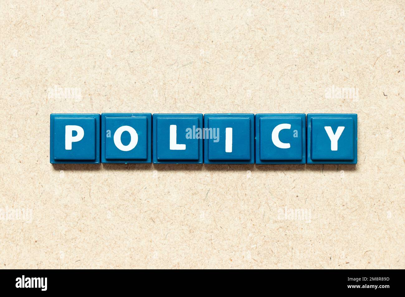 Tile alphabet letter in word policy on wood background Stock Photo - Alamy