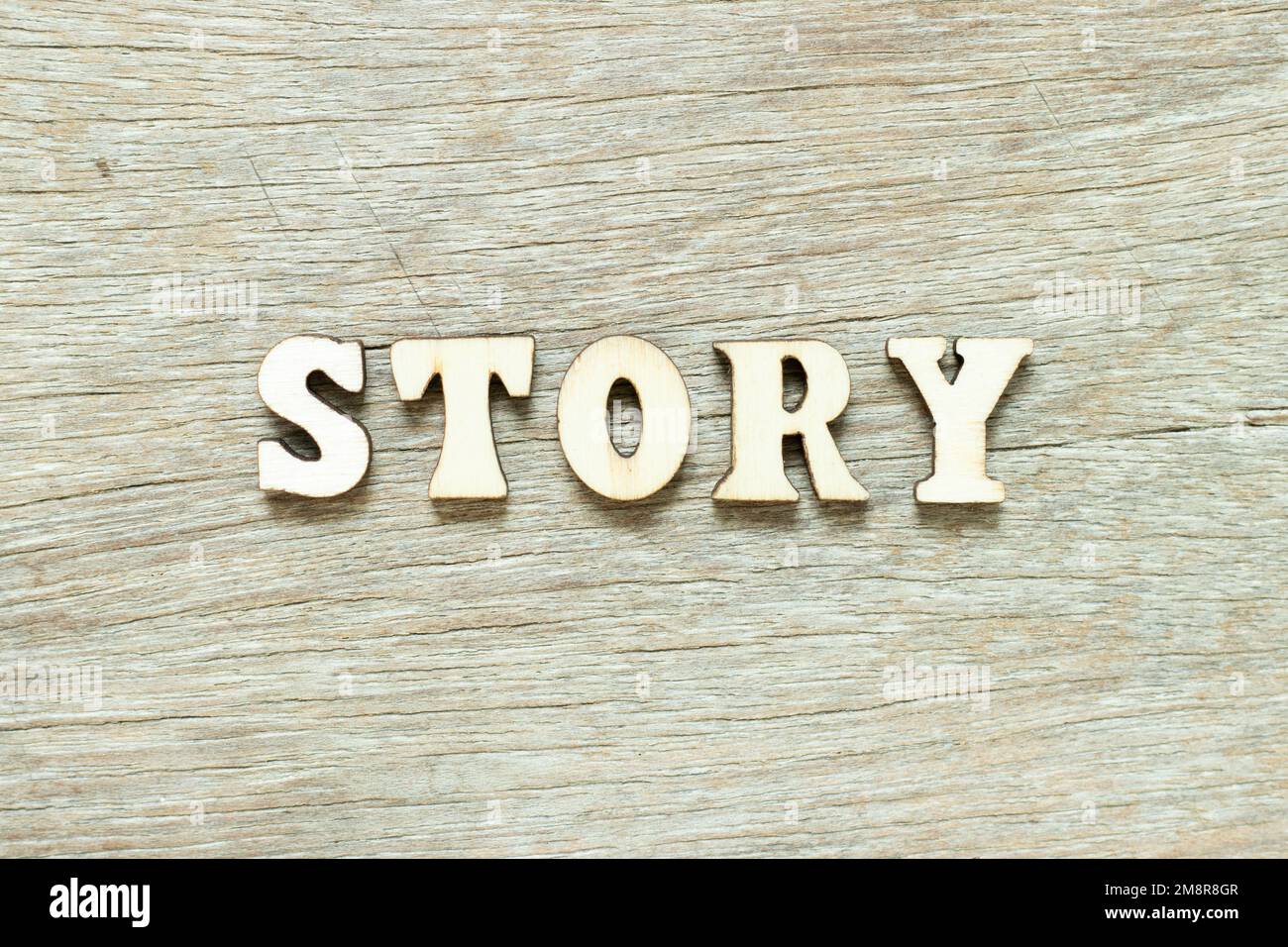 Alphabet letter in word story on wood background Stock Photo - Alamy
