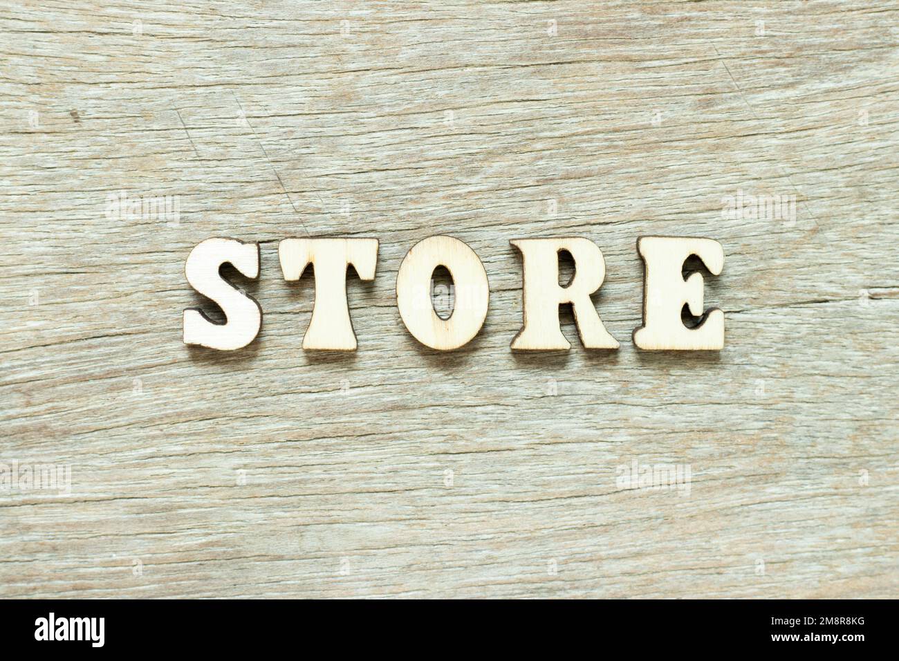 Alphabet letter in word store on wood background Stock Photo - Alamy