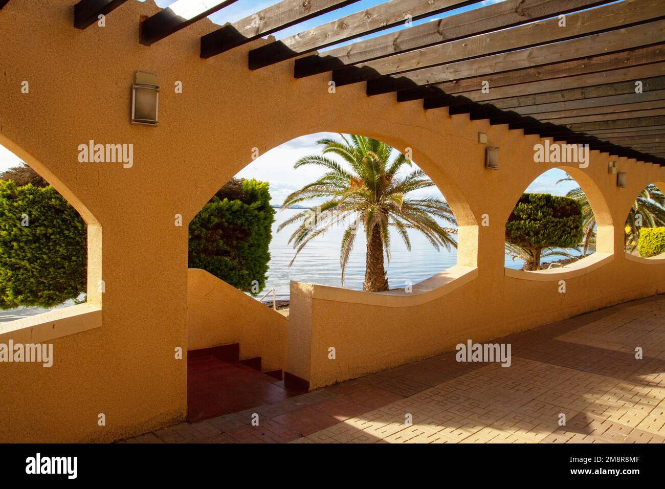 semicircular arch with round windows overlooking the sea Stock Photo ...