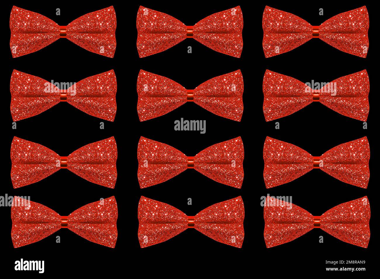 Lots of red shiny bows on a black background Stock Photo - Alamy
