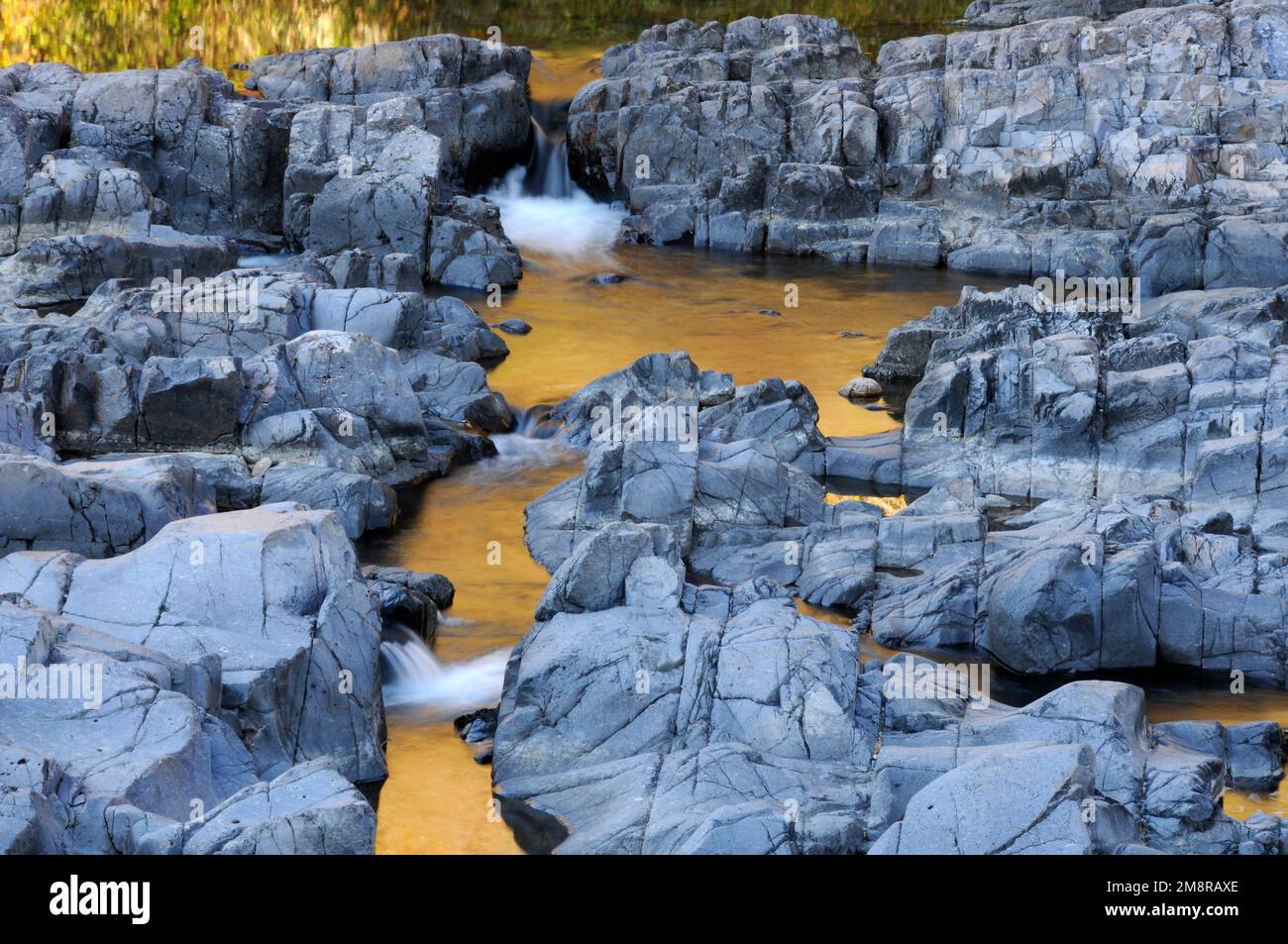 Autumn color reflects off the water at Johnson Shut-Ins State Park in ...