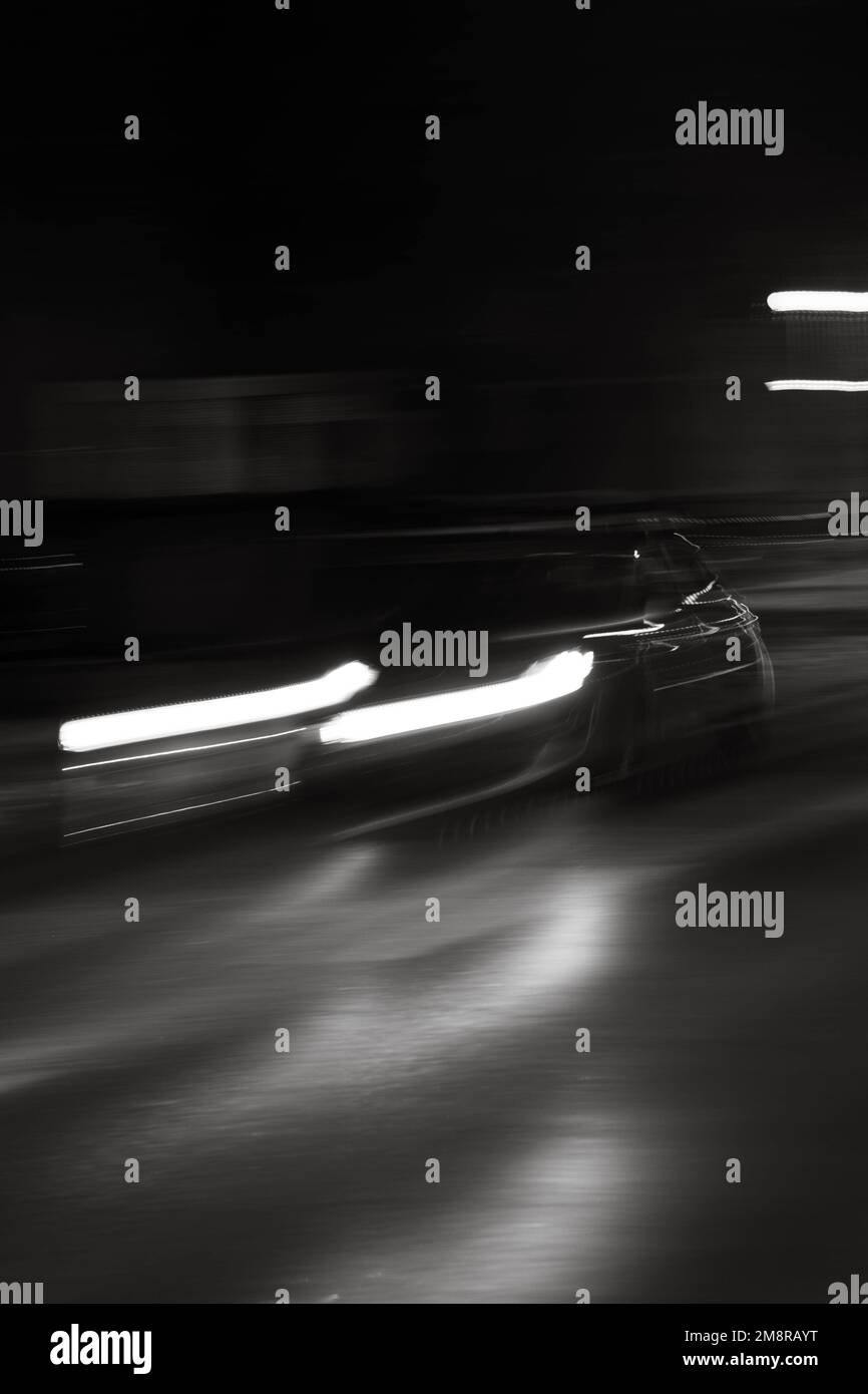 Long Exposure shot of a moving car which gave it the apperance of ...