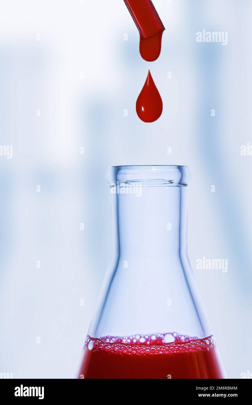 A drop of blood. Pipette. Medical flask with red liquid. Flask with ...