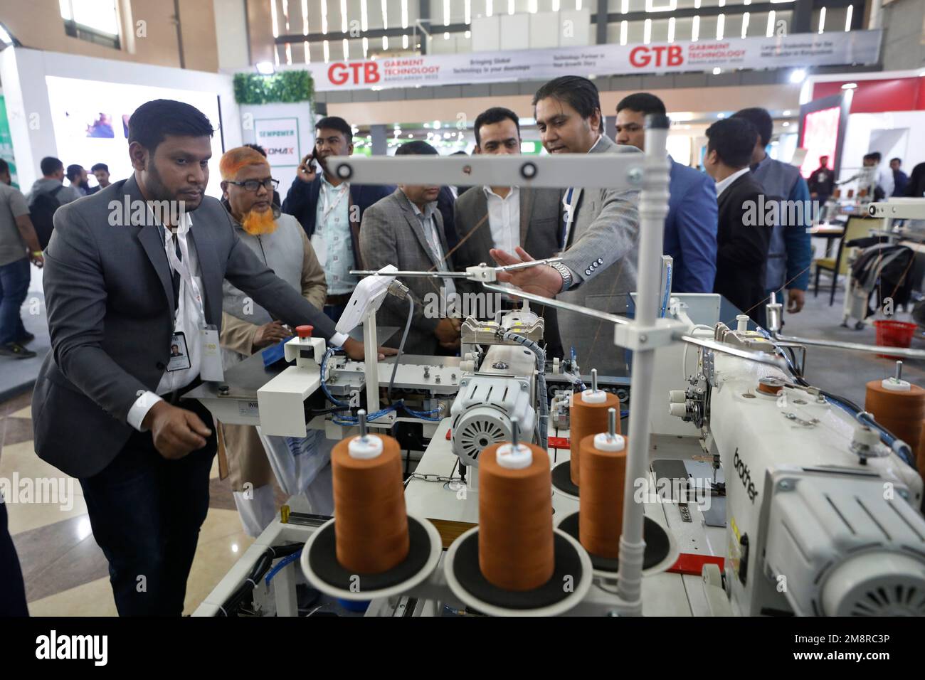 Dhaka, Bangladesh - January 13, 2023: Garment machine products buyers and sellers visit three ...