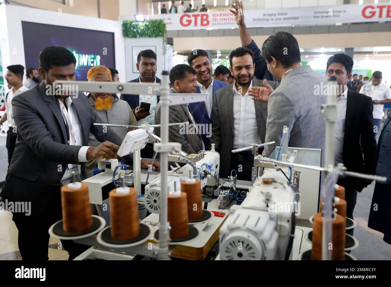 Dhaka, Bangladesh - January 13, 2023: Garment machine products buyers and sellers visit three ...