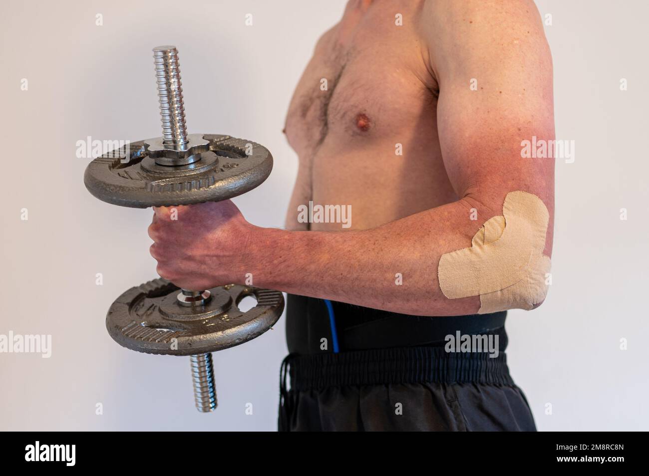 "Tennis elbow" taped with elastic therapeutic at orthopedic ward close ...