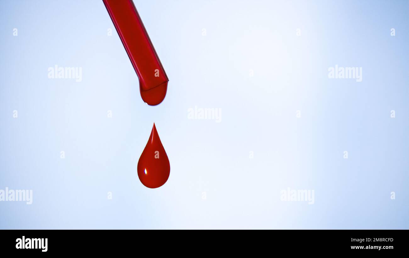 A drop of blood. Pipette. Dripping red liquid. A drop of red. Tests ...