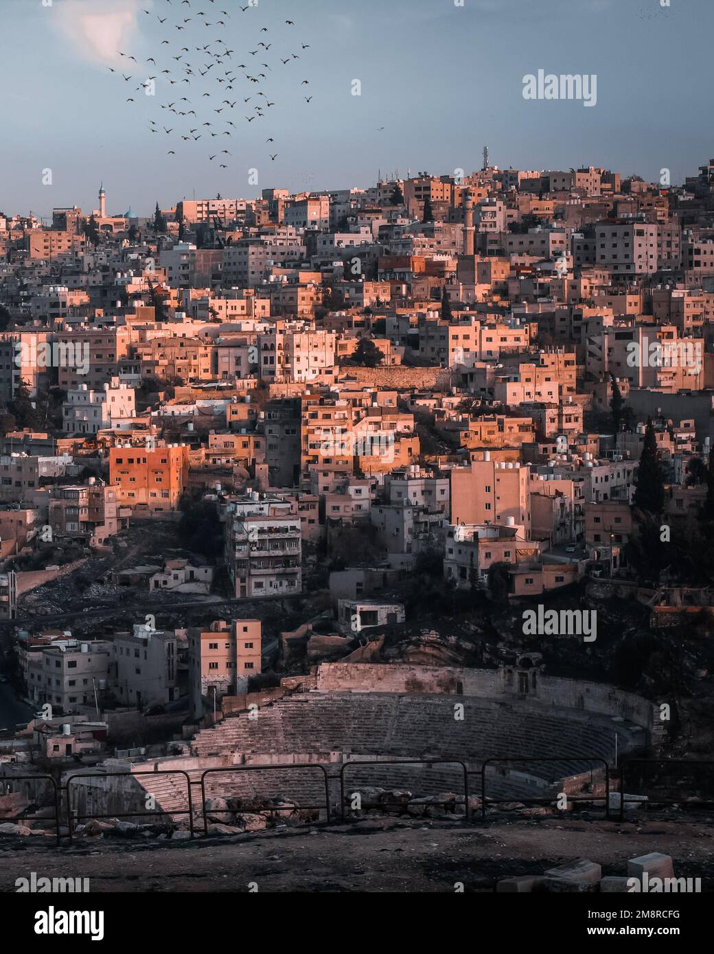 Sunset in downtown Amman capturing the roman amphitheatre, from the ...