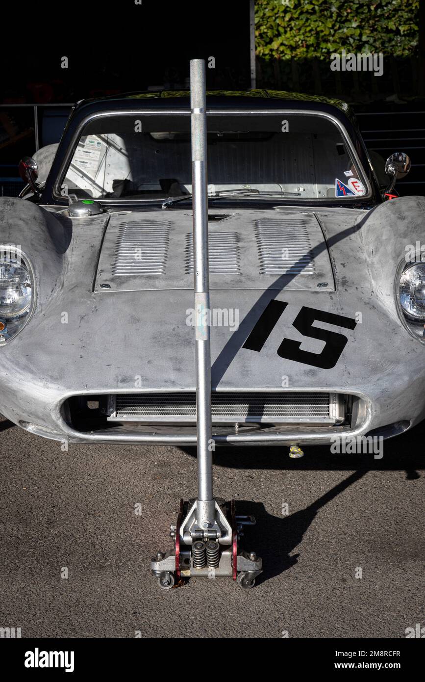 1962 Tojeiro EE-Ford in the paddock garage with a jack being prepared ...