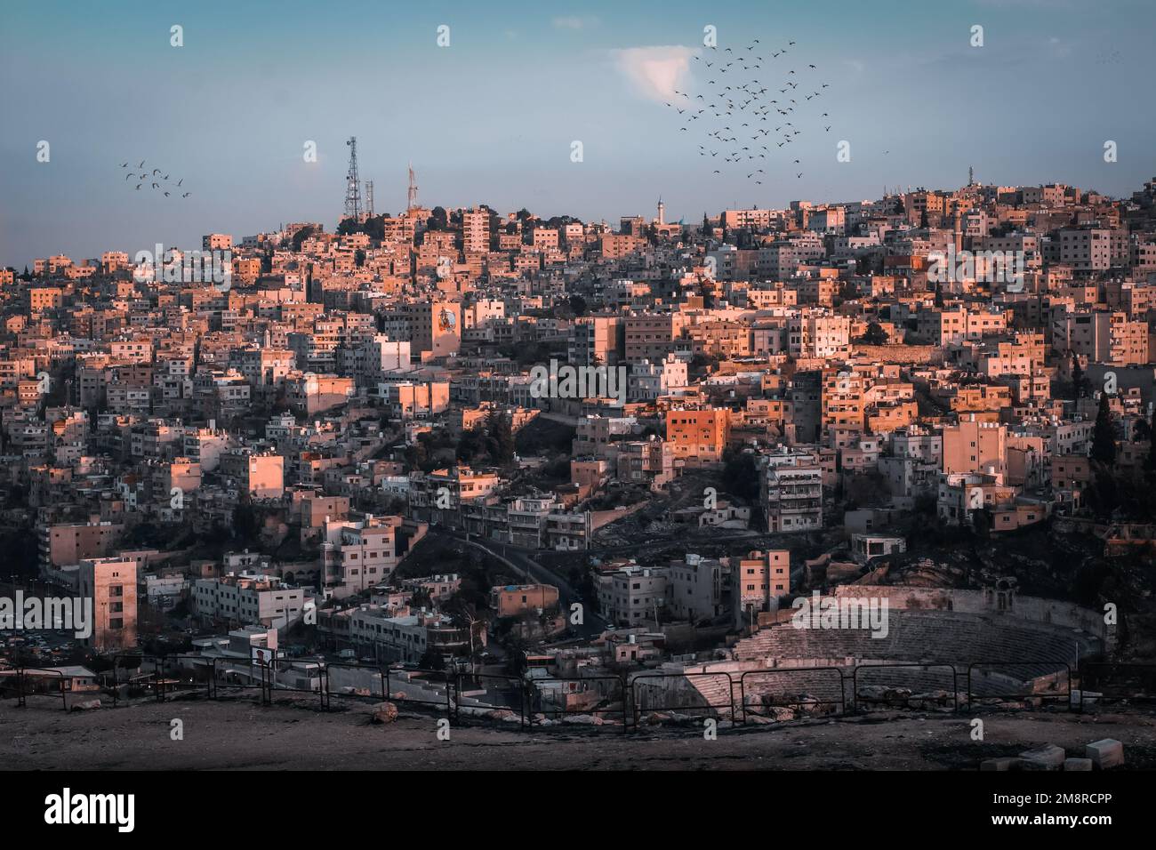 Downtown Amman landscape at sunset, capturing the golden hour sunlight ...