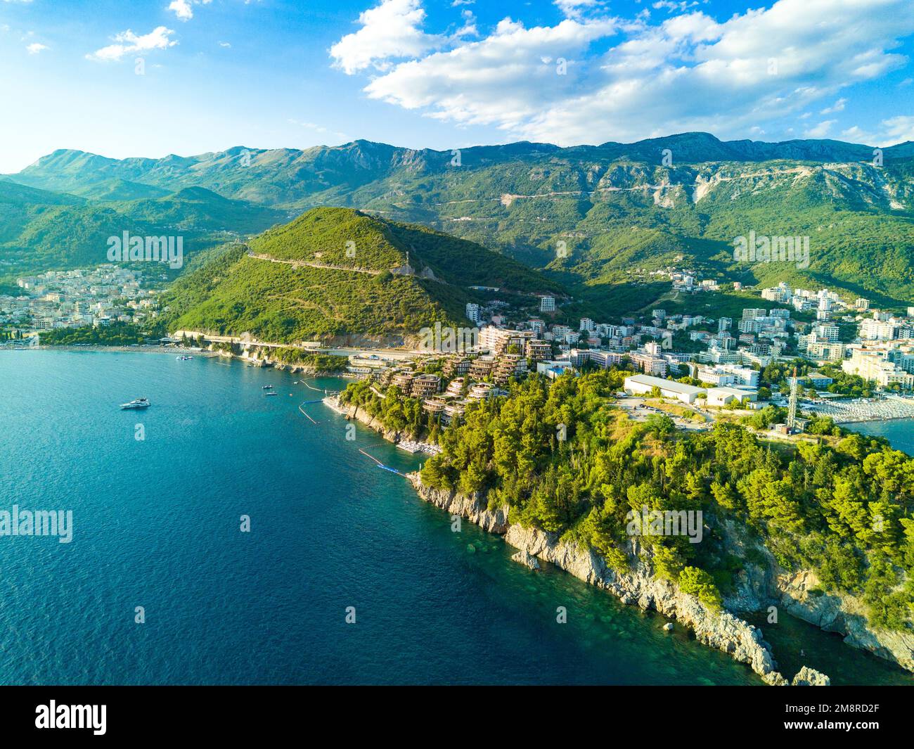 Bird's eye view of historical resort towns of Budva and Becici with luxury hotels and ...