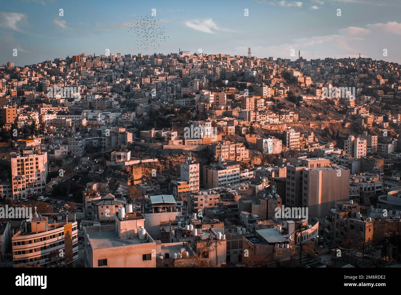 Downtown Amman landscape at sunset, capturing the golden hour sunlight ...