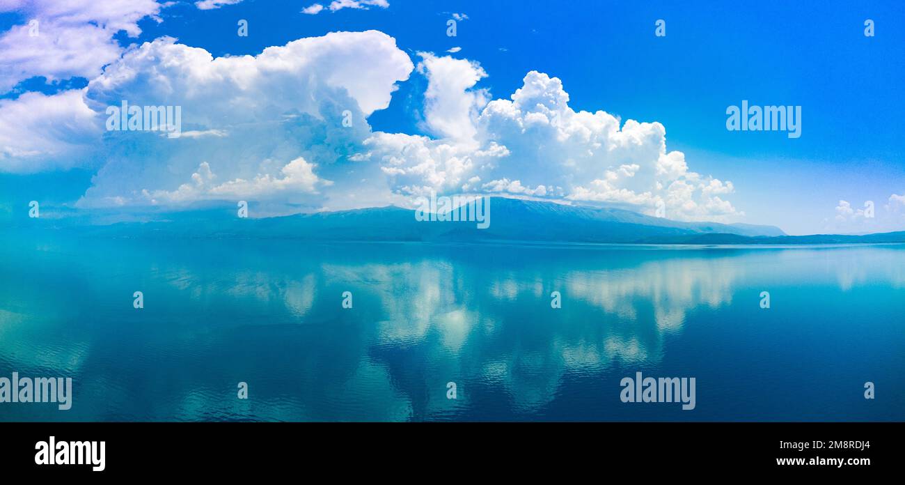Panorama of majestic huge white thick clouds float across the clear ...