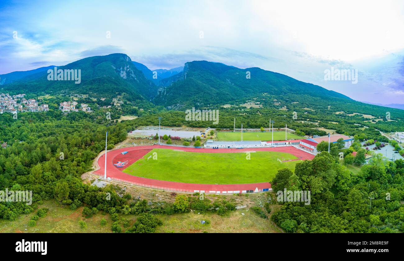 Panorama of sports ground with a running area and a football field near ...