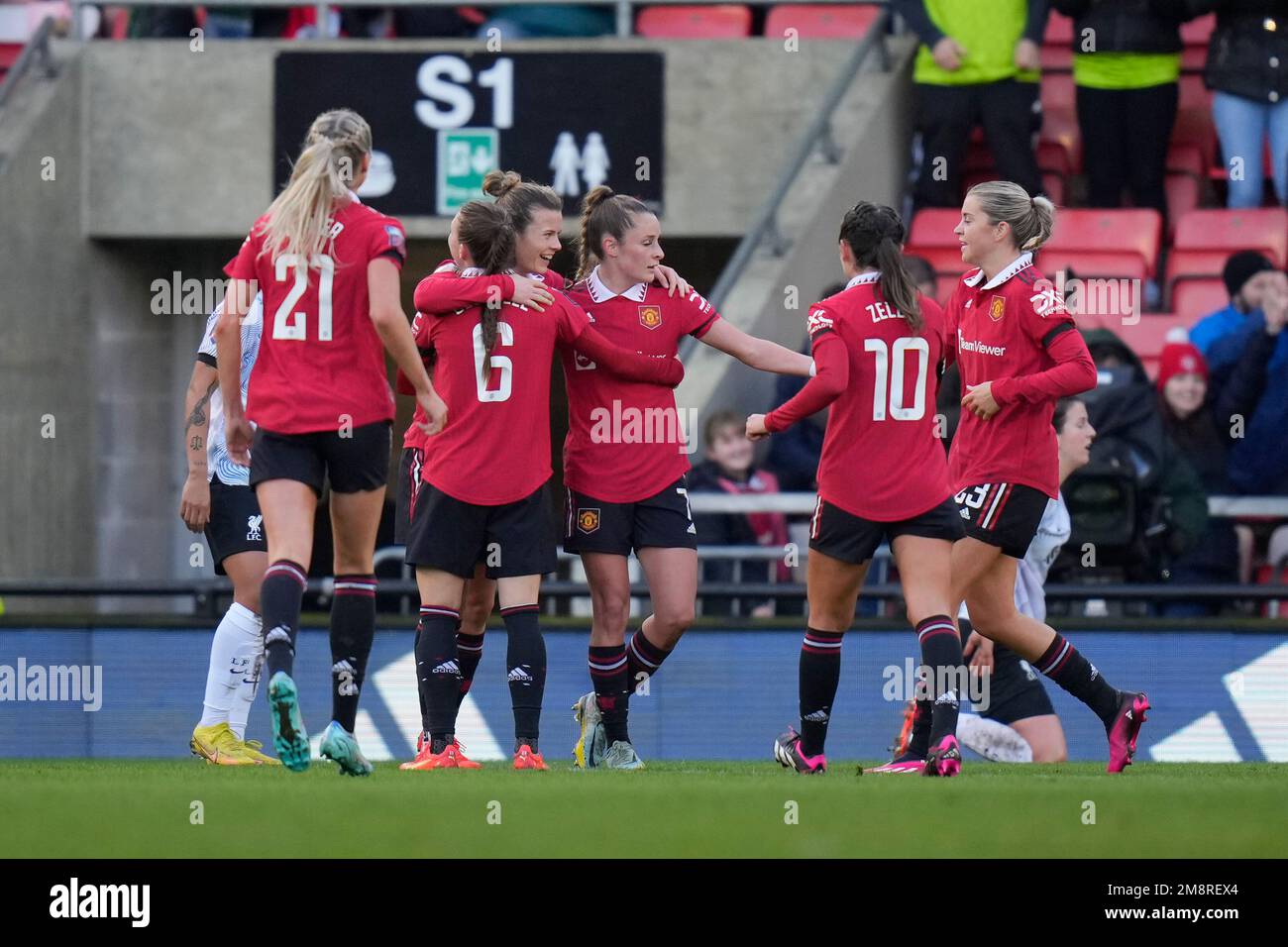 ManchesterUnited players celebrate with Hayley Ladd #12 of Manchester ...