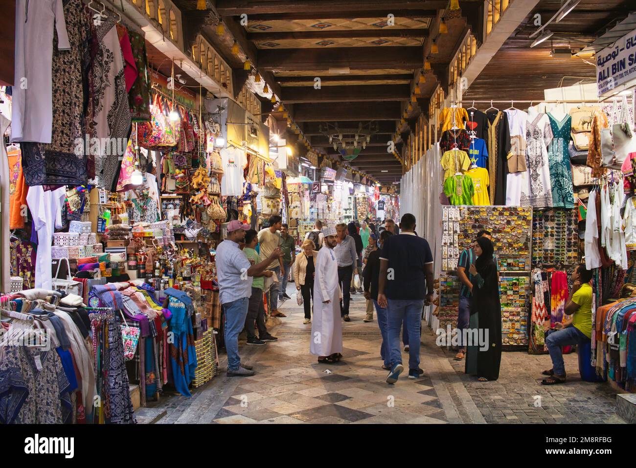 The people busy selling in Muscat city during a Sunday morning Stock ...