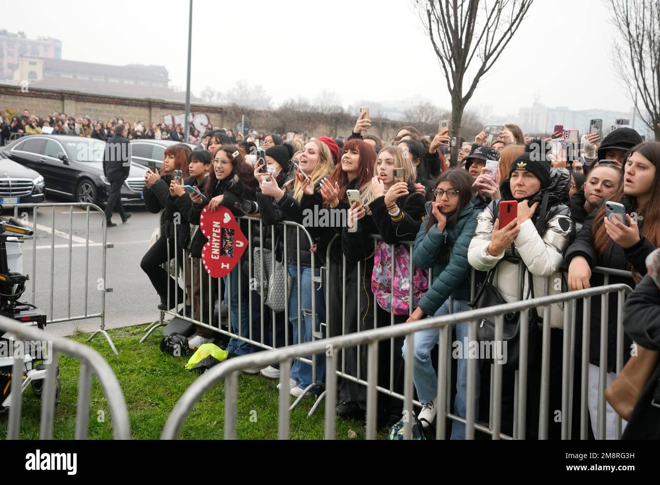Fans of South Korean K-pop group ENHYPEN cheer as they see them before ...