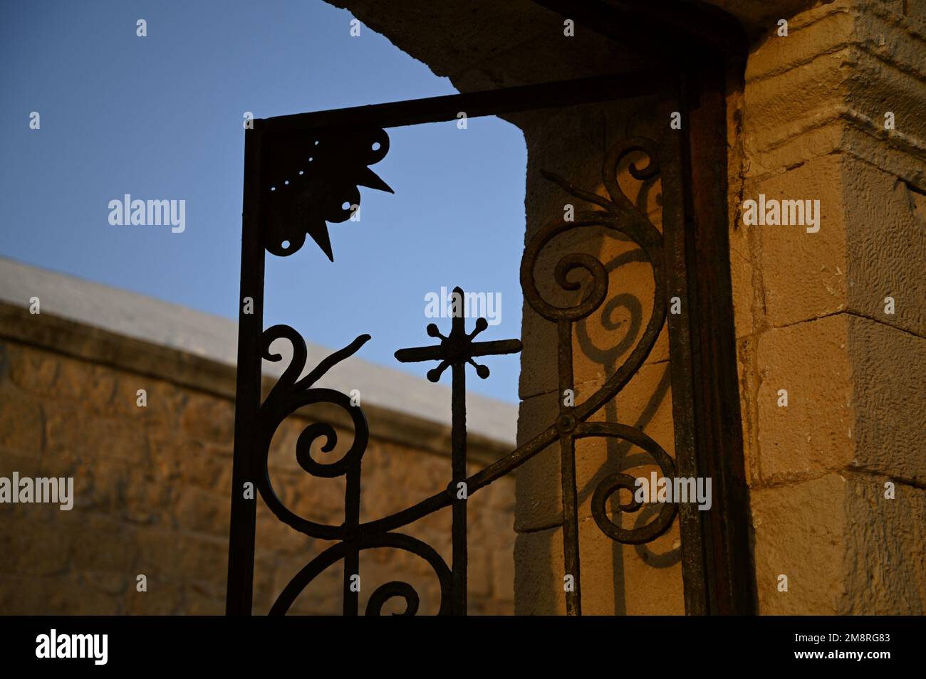 Traditional handcrafted wrought iron main entrance gate of Aghioi ...