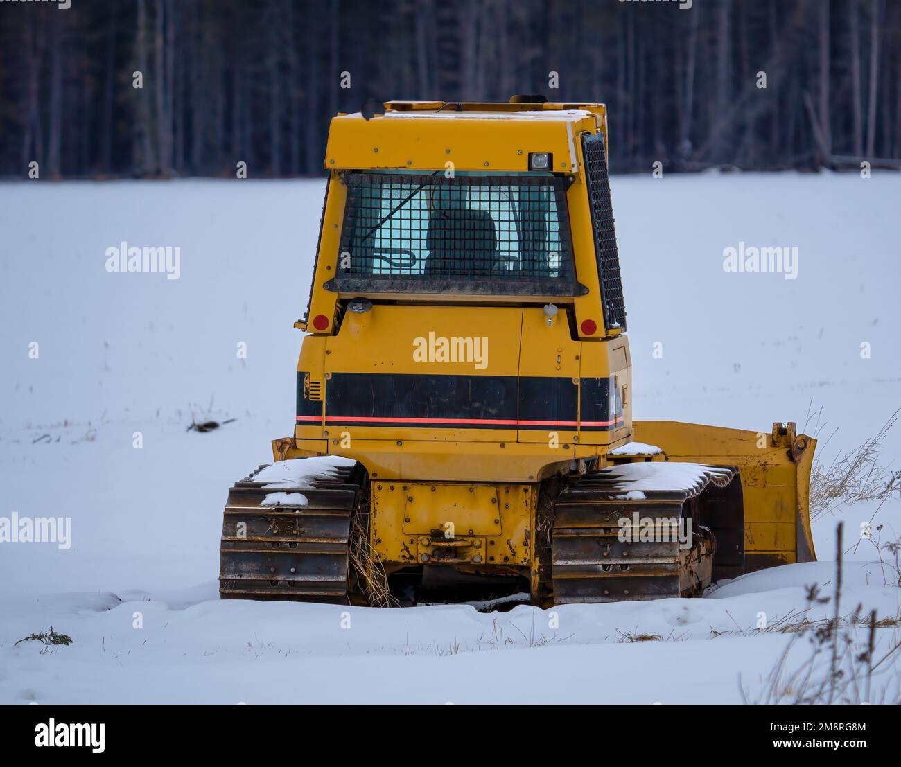 Bulldozer sitting in field that was cleared for agriculture use in ...