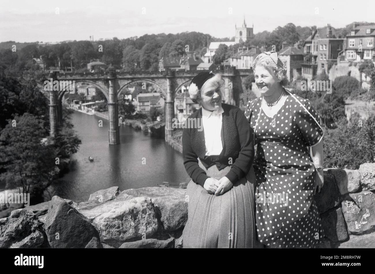 1950s, historical, two well-dressed, mature ladies sitting beside each ...