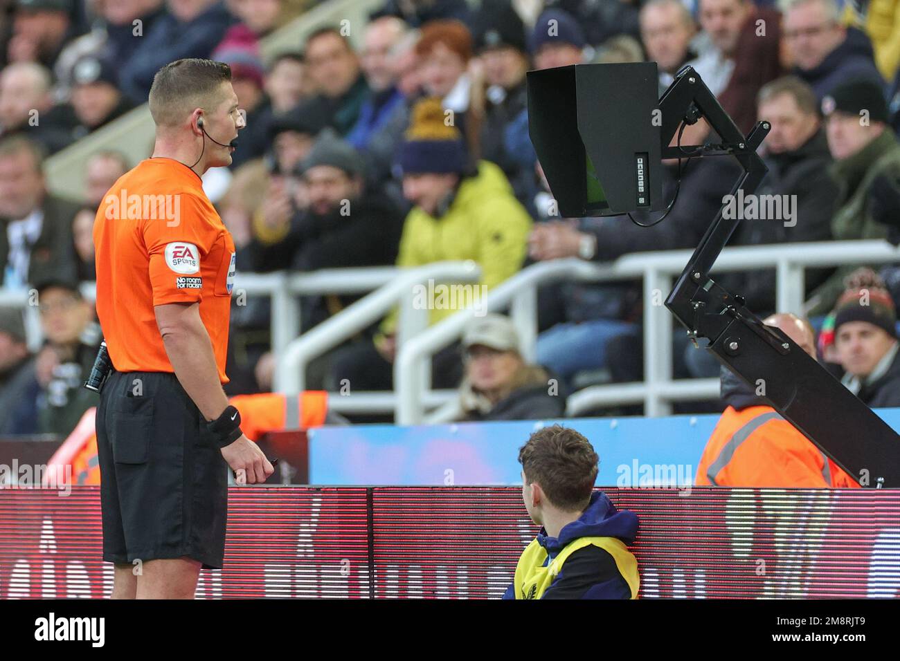 Referee Robert Jones checks the VAR screen during the Premier League ...