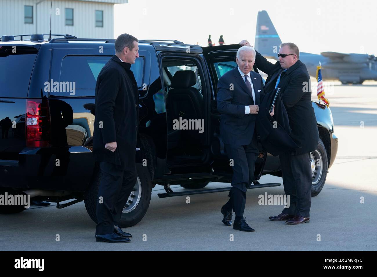 President Joe Biden steps from his motorcade vehicle as he arrive to ...