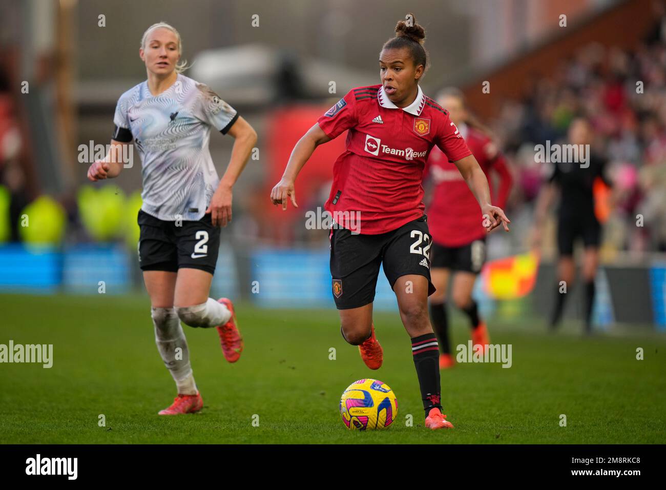 Nikita Parris #22 of Manchester United breaks past Emma Koivisto #2 of ...